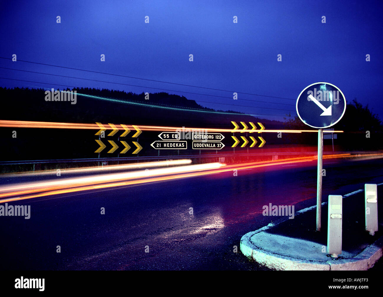 Road with light trails at night Stock Photo - Alamy
