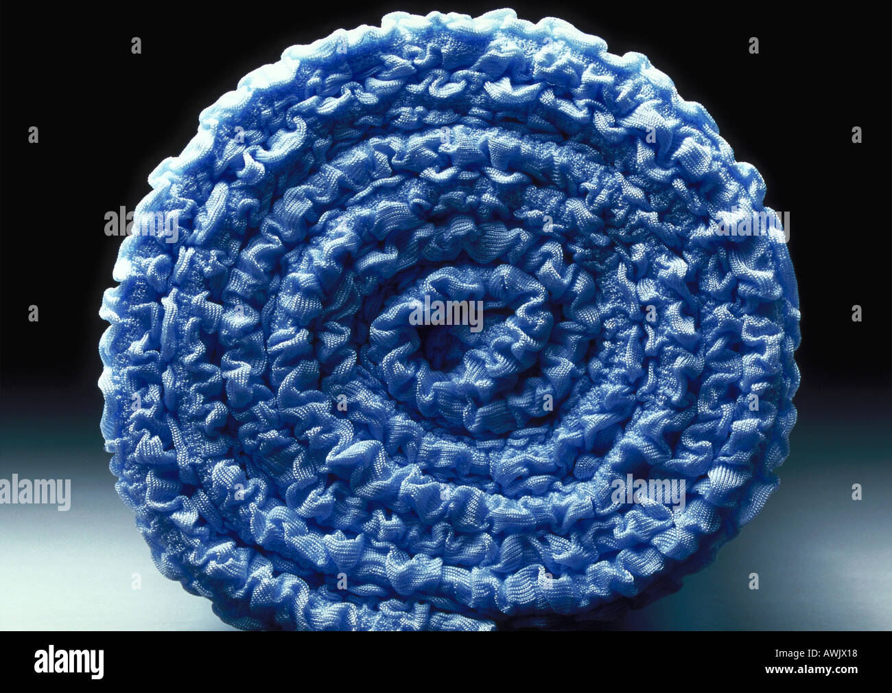 Roll of blue fabric, side view Stock Photo - Alamy