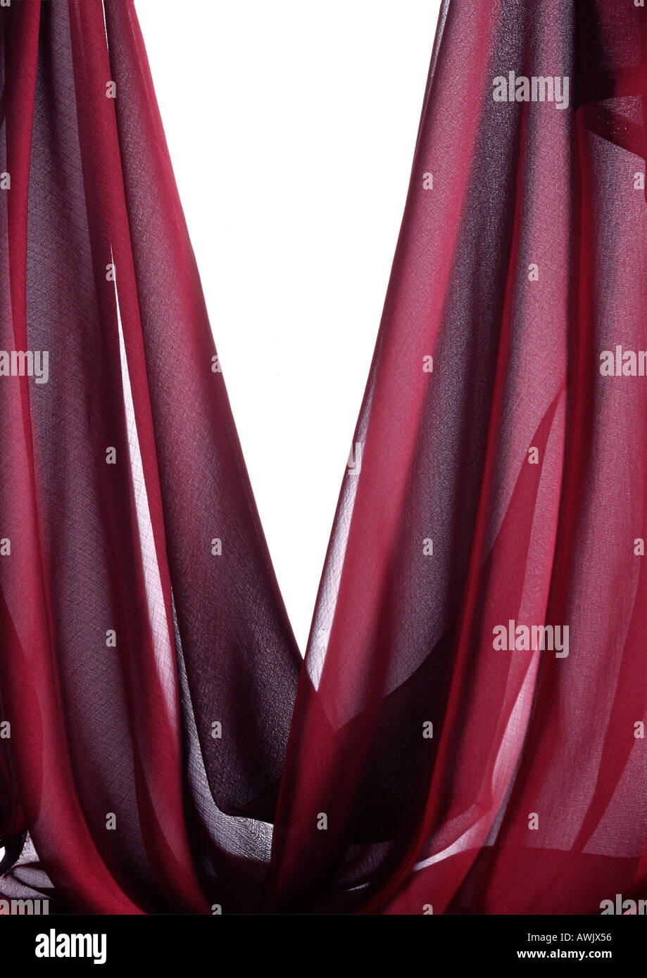 Draped sheer red fabric Stock Photo - Alamy