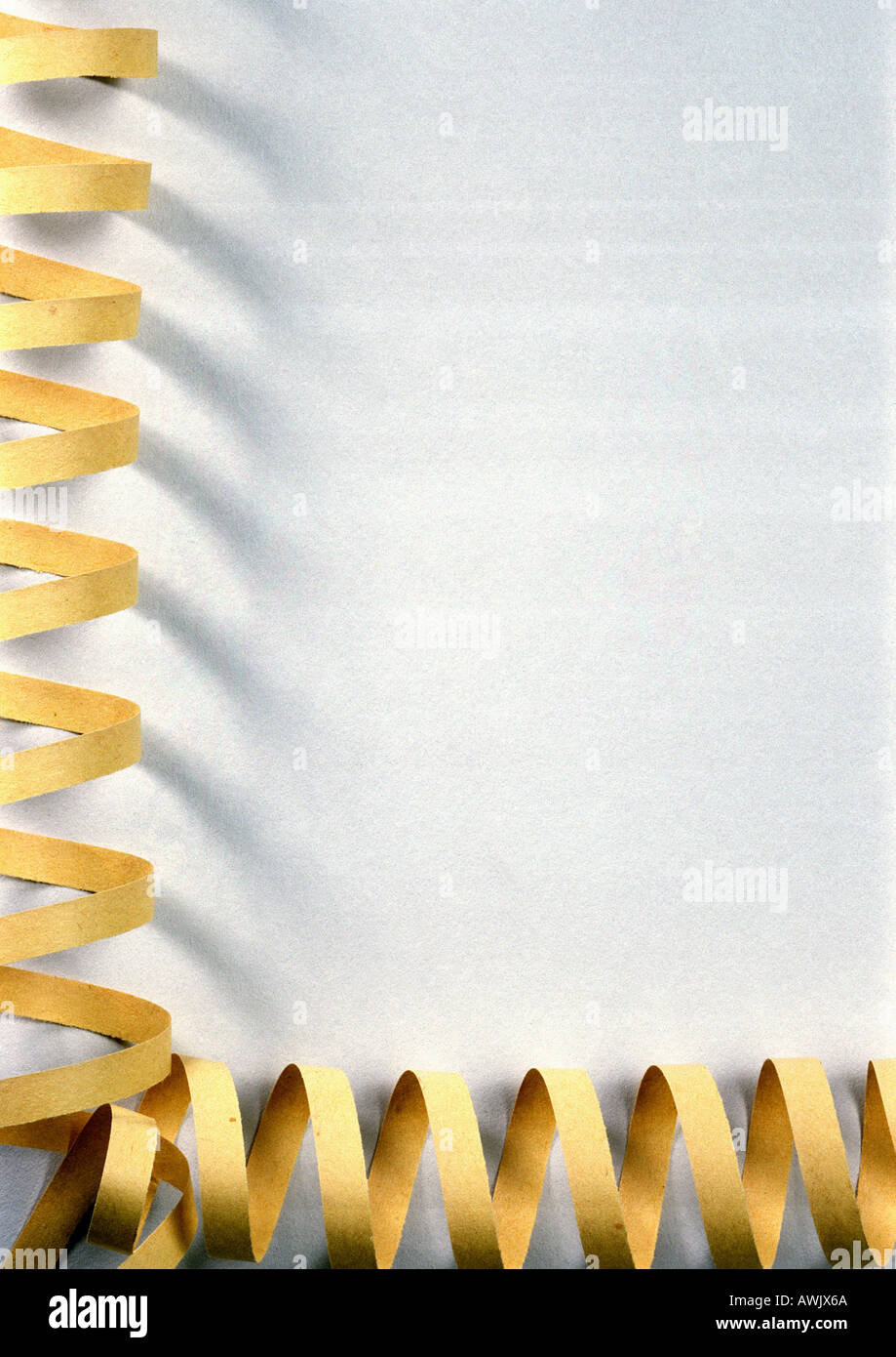 Yellow ribbon on white background Stock Photo - Alamy