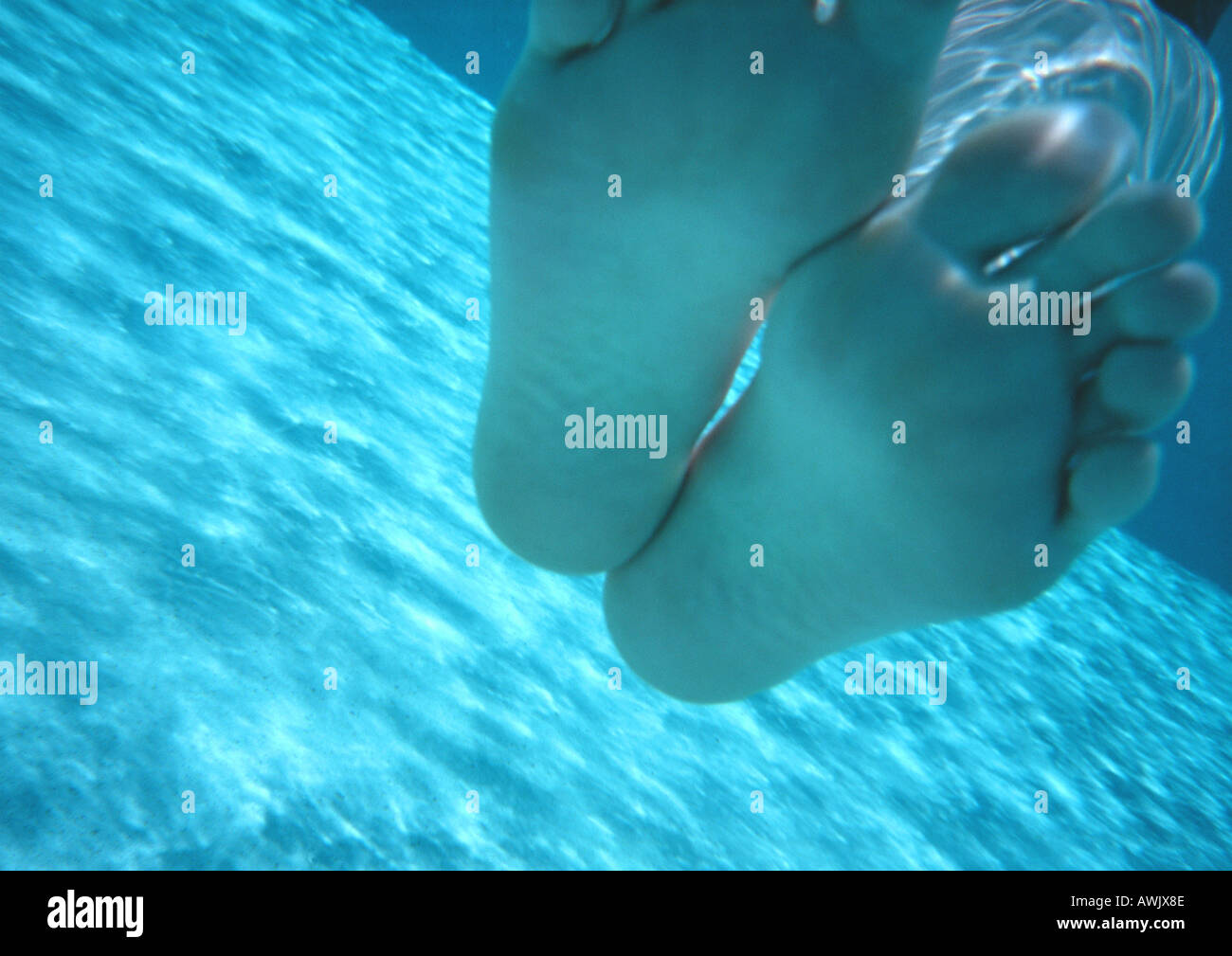Person's feet under water Stock Photo - Alamy