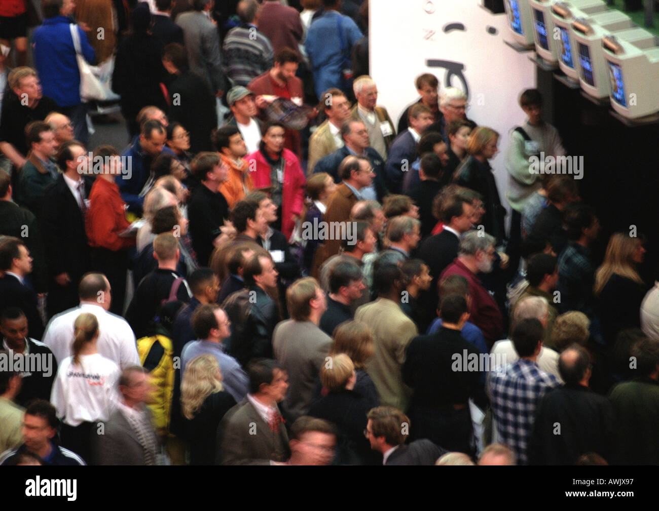 Crowd of people near television monitors, blurred Stock Photo - Alamy