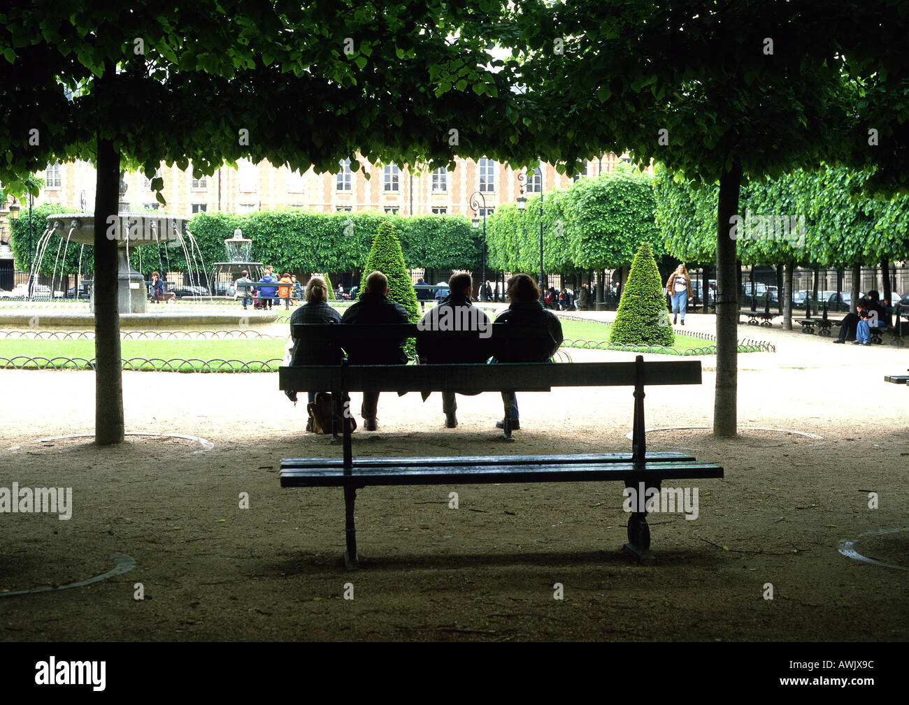 People sitting together on bench in park, rear view Stock Photo - Alamy
