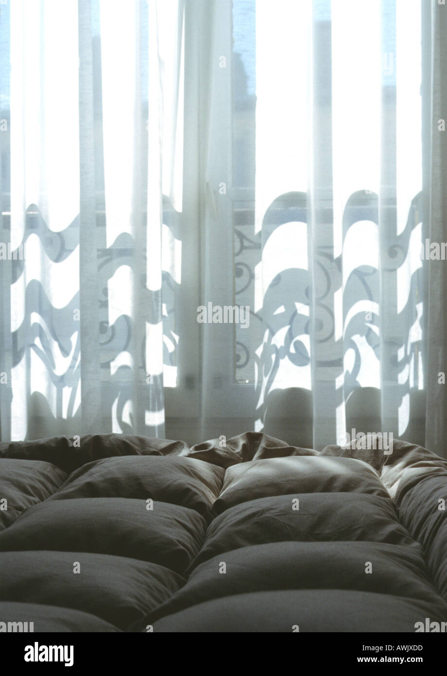 Bedding near window Stock Photo - Alamy