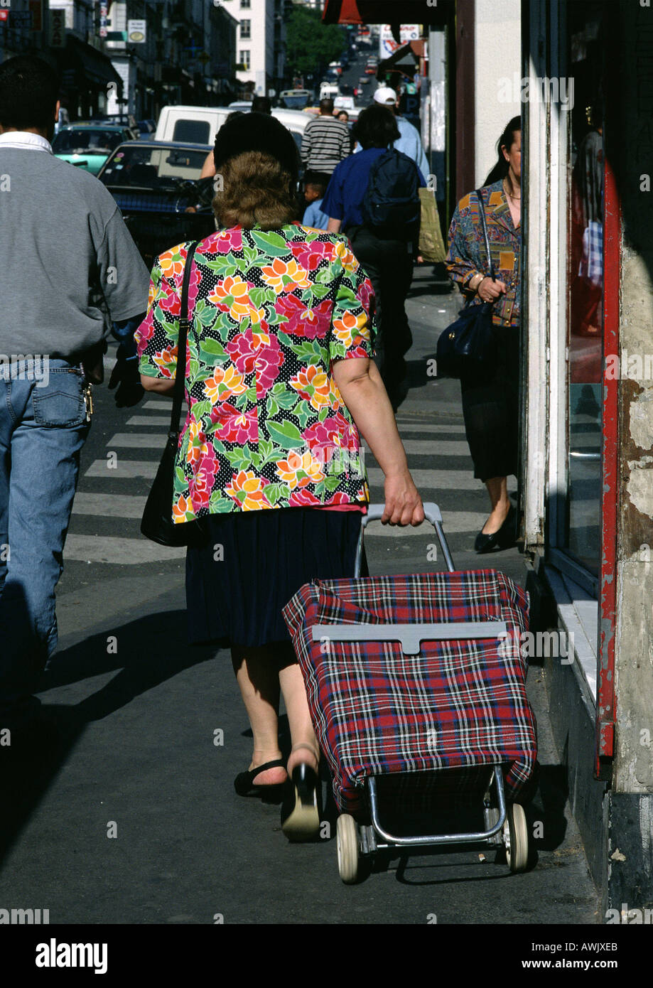 Back view walking woman pulling hi-res stock photography and images - Alamy