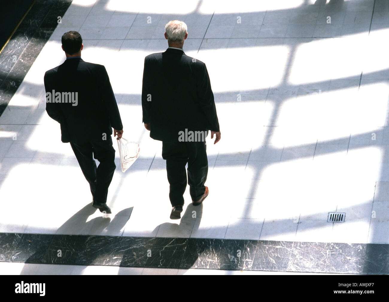 Two people walking together from above hi-res stock photography and ...