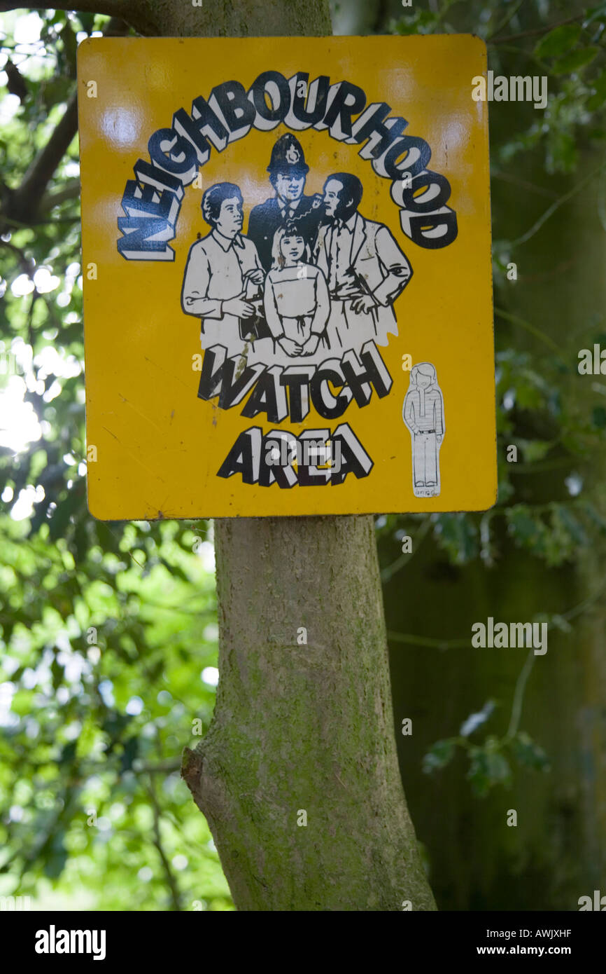 Neighbourhood Watch sign attached to a tree Stock Photo - Alamy