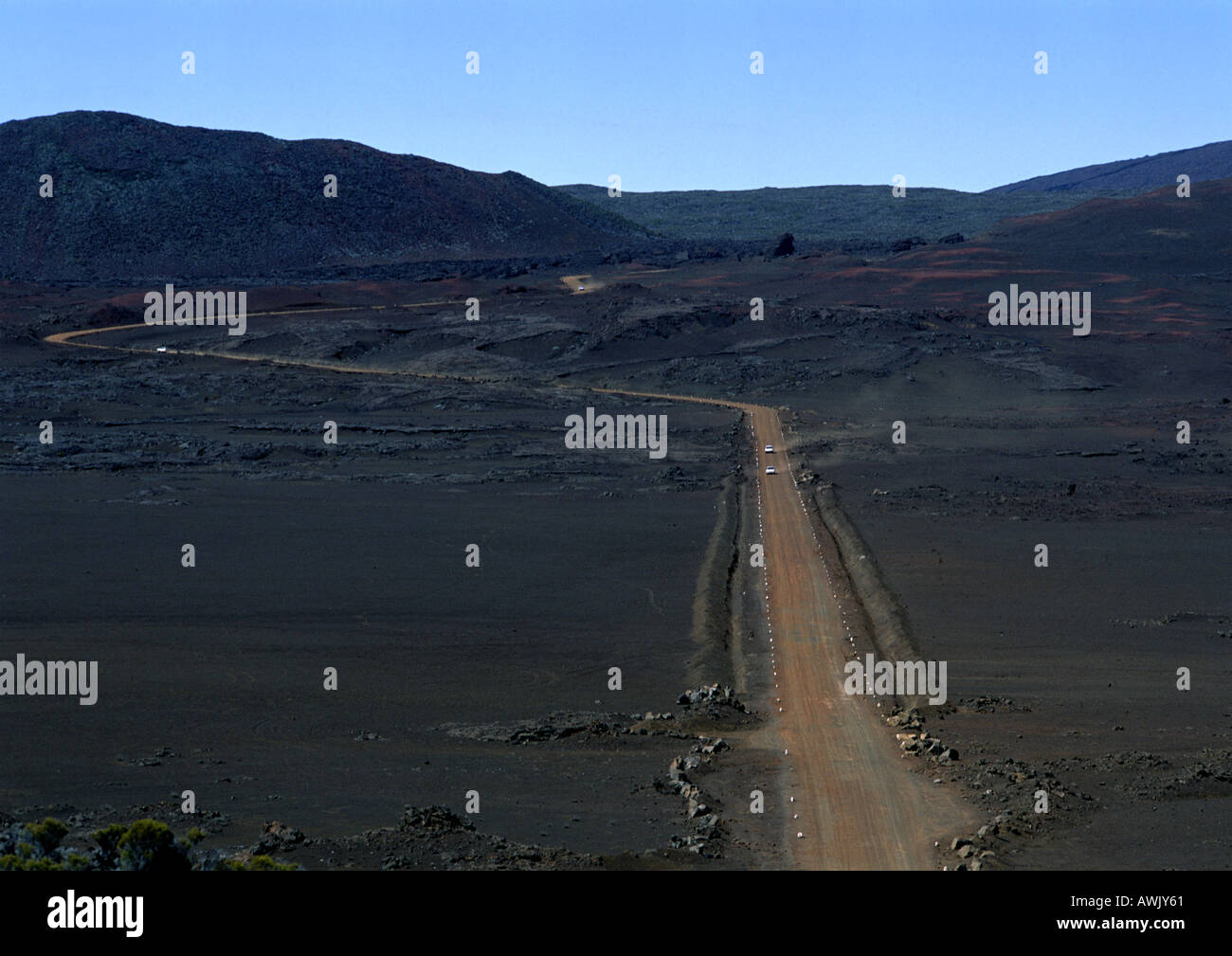 Dirt road through mountainous desert region Stock Photo - Alamy