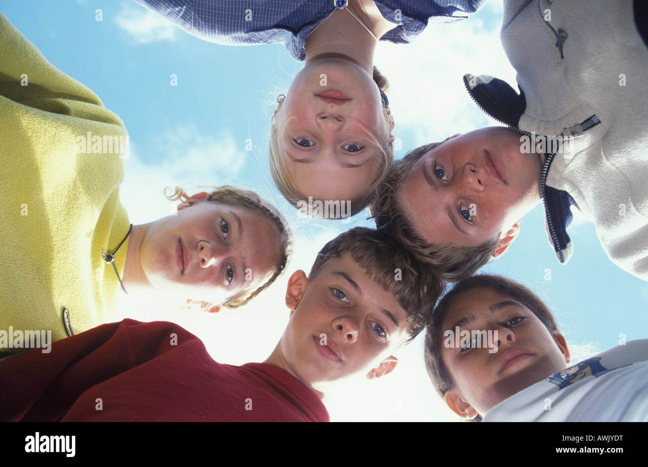 group of teenagers looking down into camera Stock Photo - Alamy