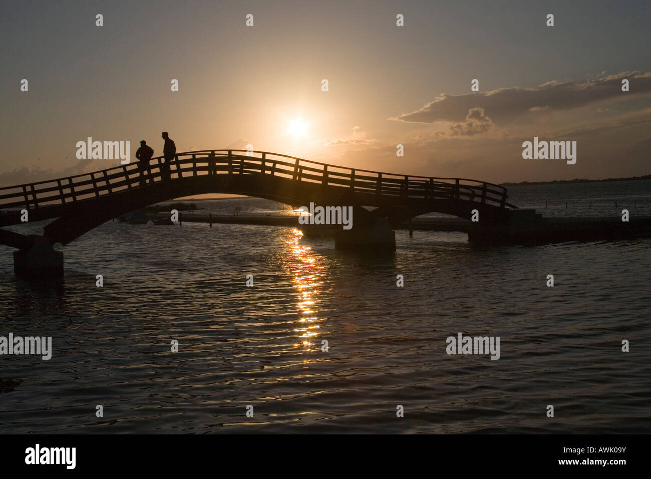 two men on the bridge at sundown Stock Photo - Alamy