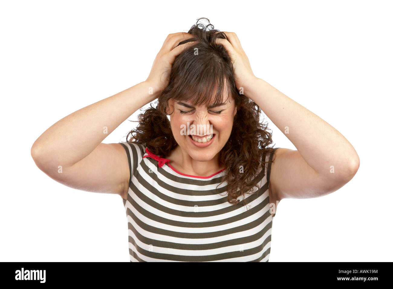 Angered young woman over a white background Stock Photo - Alamy