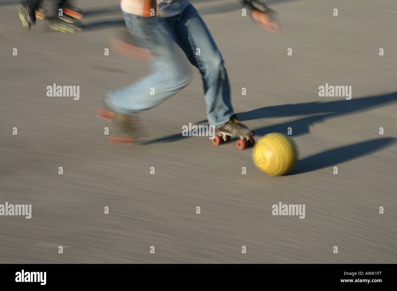 rollerblader soccer player chasing ball Stock Photo - Alamy