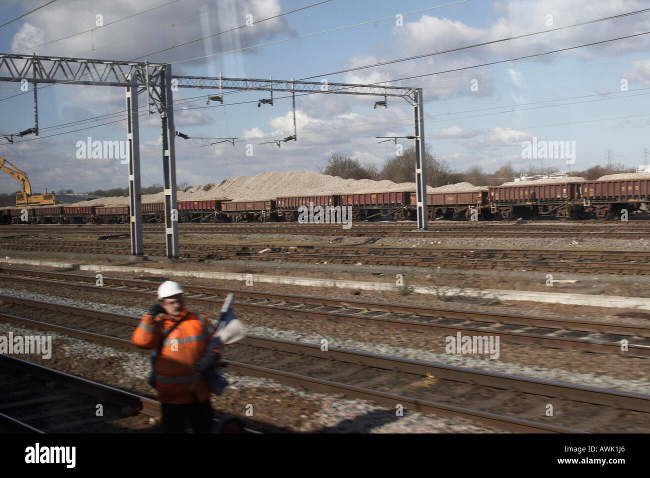 Electrified railway lines goods train and maintenance repair workers on ...