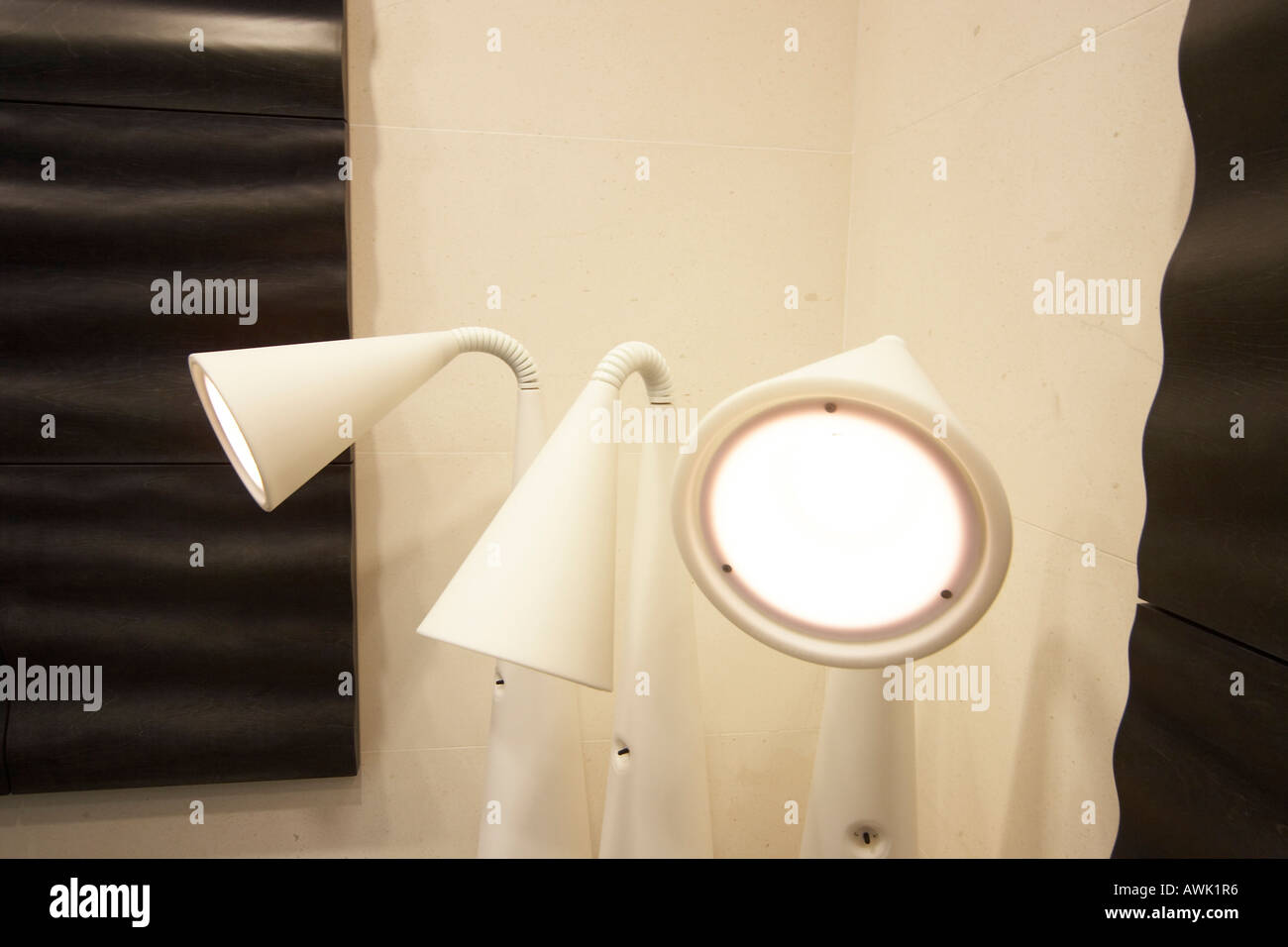 abstract image of three lamp lights facing in different directions with ...