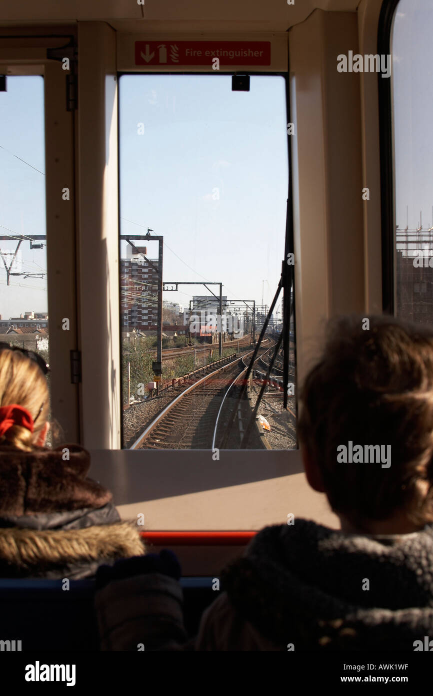 Young girl looking out of window of DLR Docklands Light Railway train ...