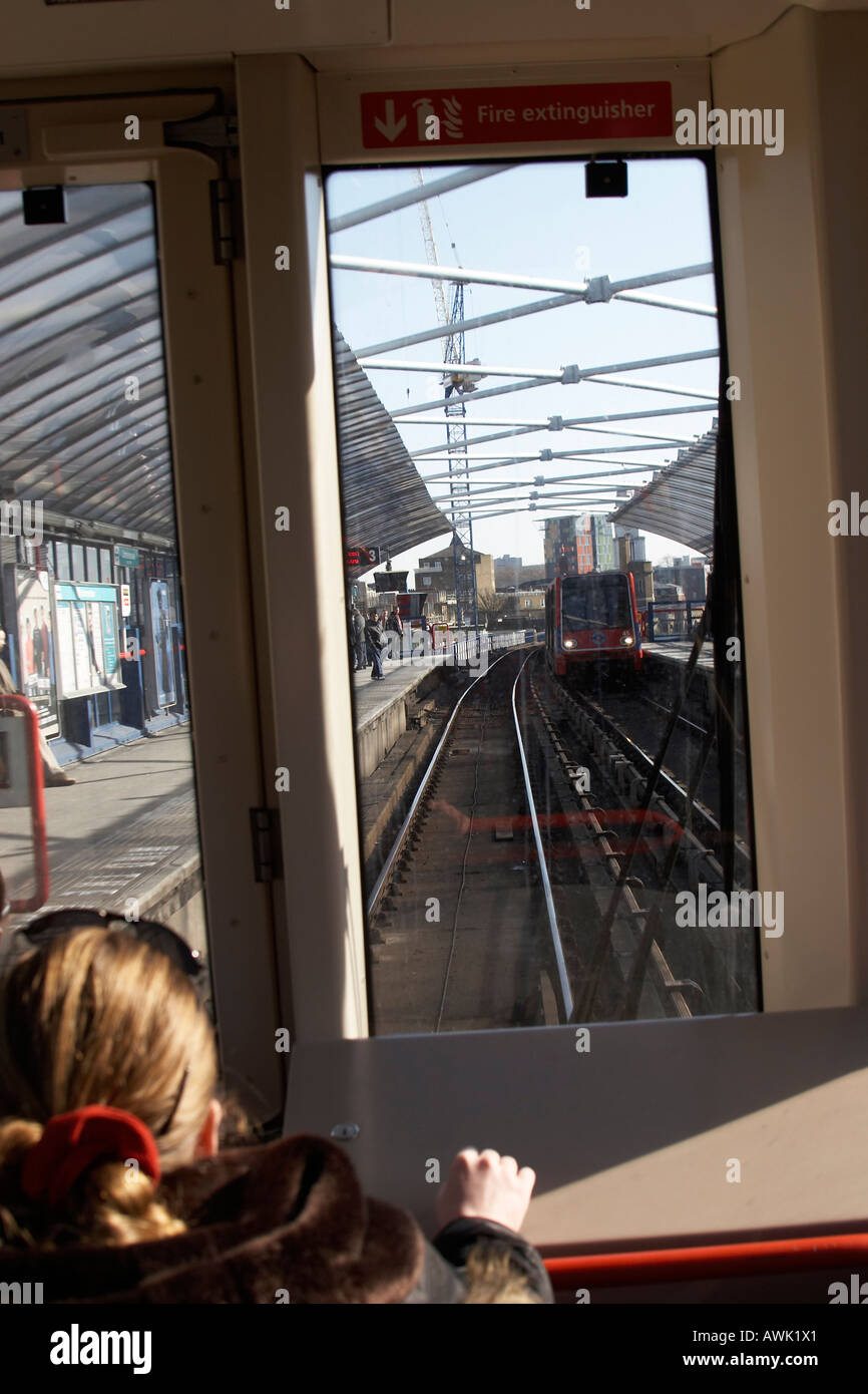 Young girl looking out of window of DLR Docklands Light Railway train ...