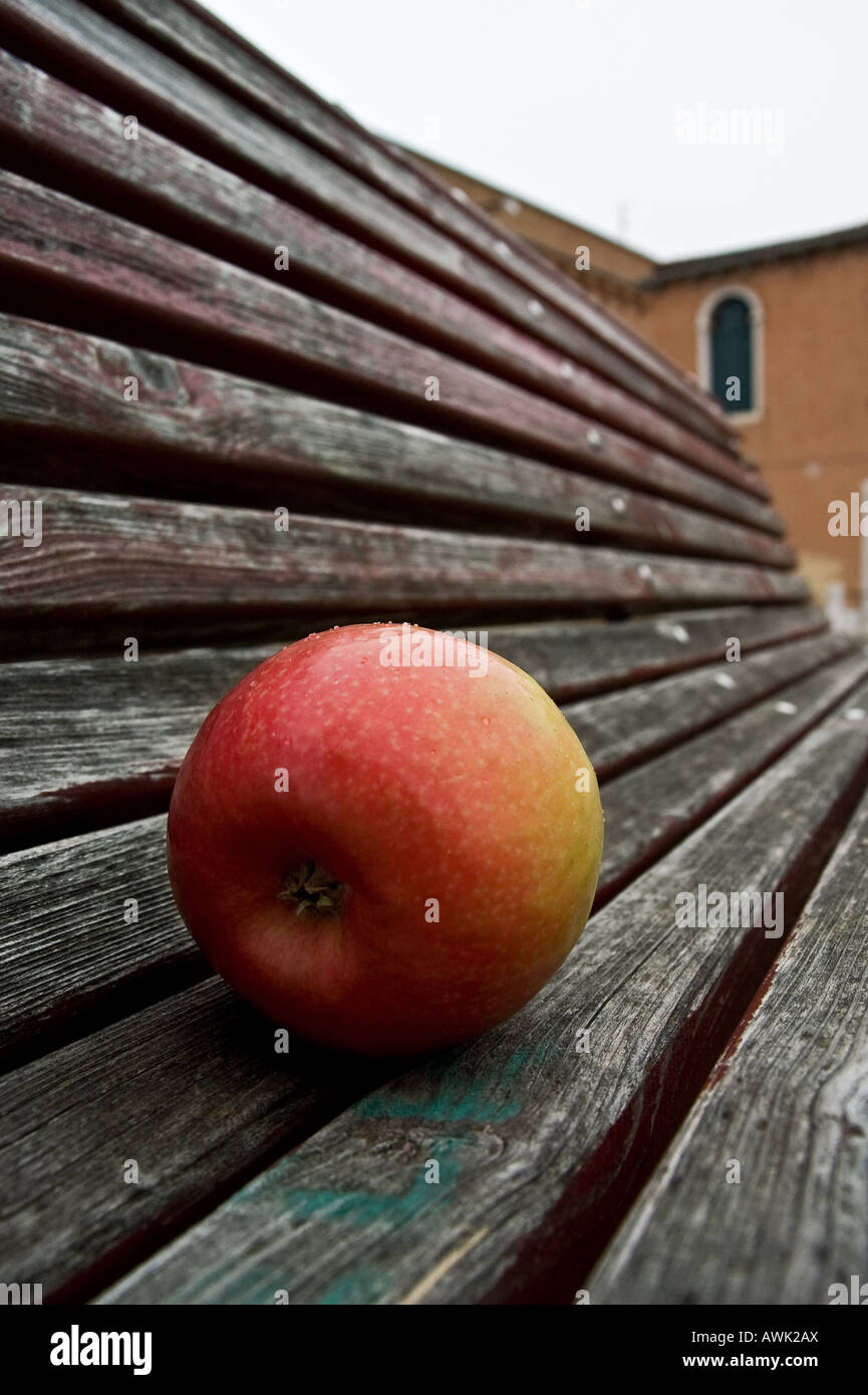 Apple on the lonely bench Stock Photo - Alamy