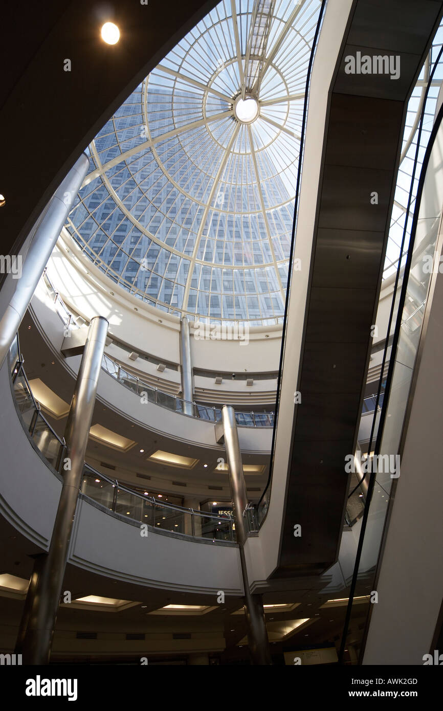 View up atrium of Canary Wharf Statiion on DLR shopping plaza with ...