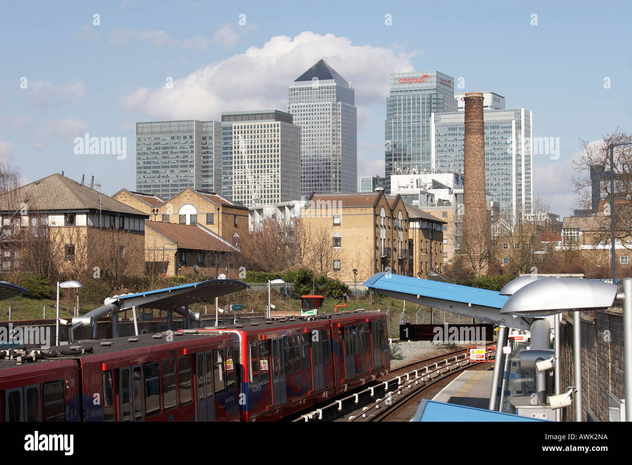 DLR Docklands Light Railway train at Crossharbour Station with tall ...