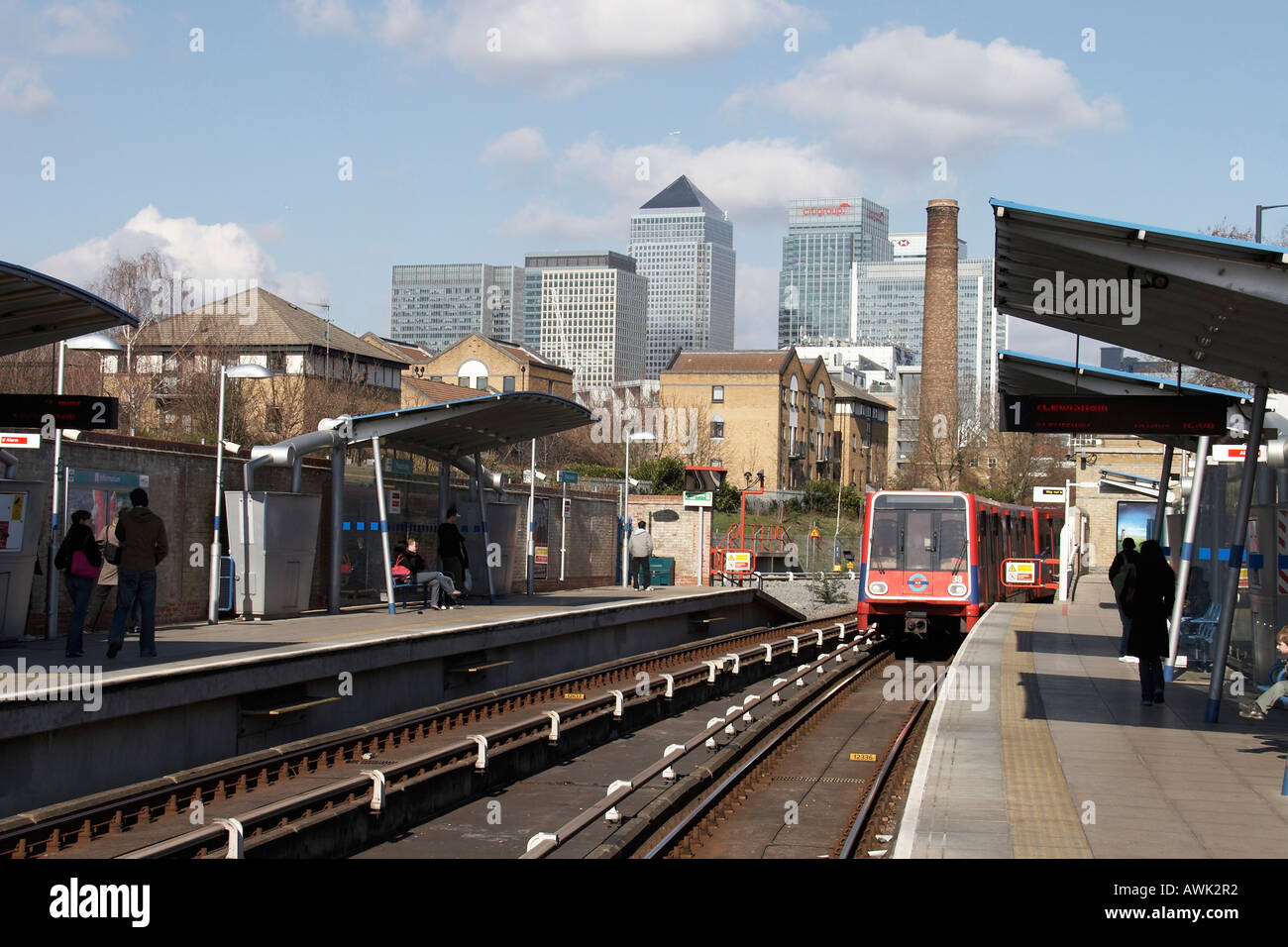 DLR Docklands Light Railway train at Crossharbour Station with tall ...