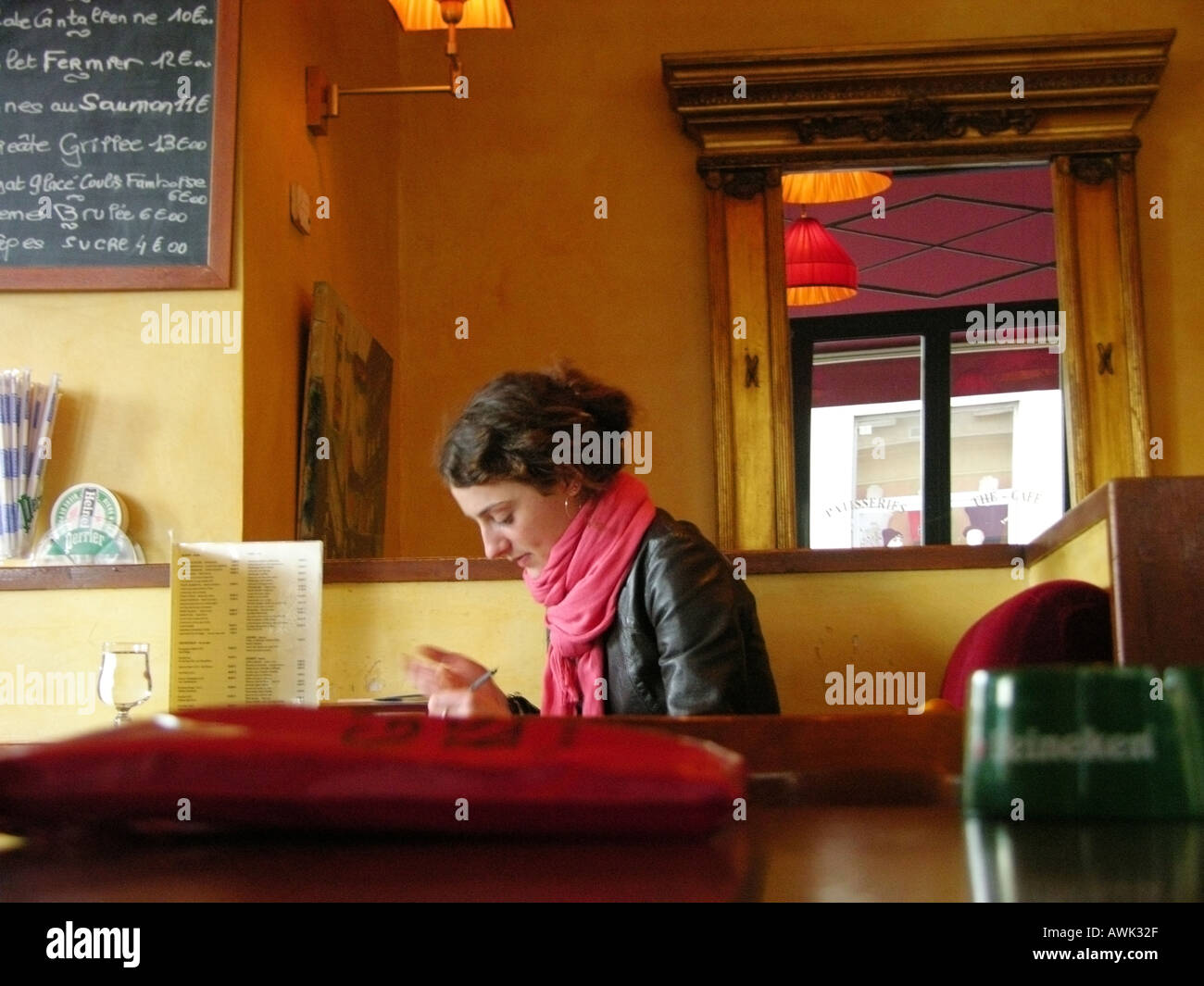 france paris young woman writing in cafe Stock Photo - Alamy