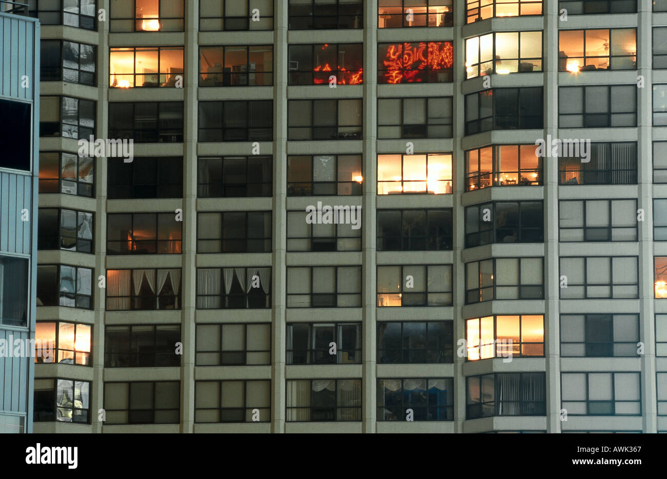 Windows of building lit up at night, Chicago, Illinois, USA Stock Photo ...