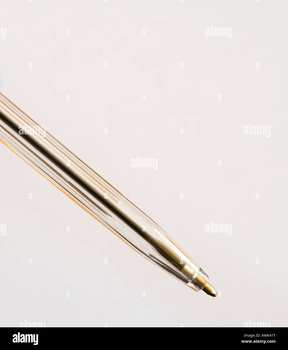 Close up view of the nib of a disposable clear plastic ballpoint pen ...