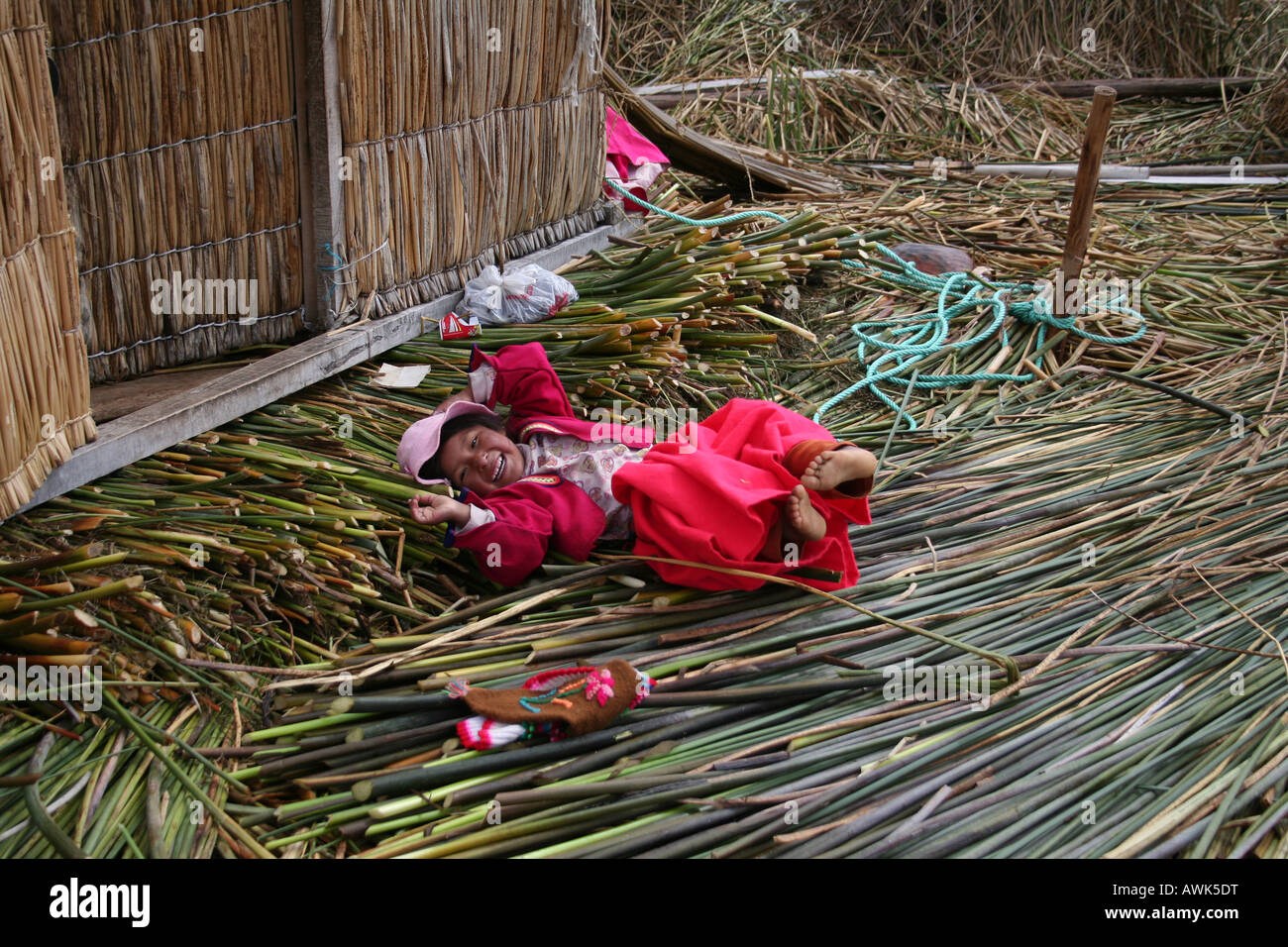 Uros girl on Uros floating reed island Lake Titicaca Peru Stock Photo ...