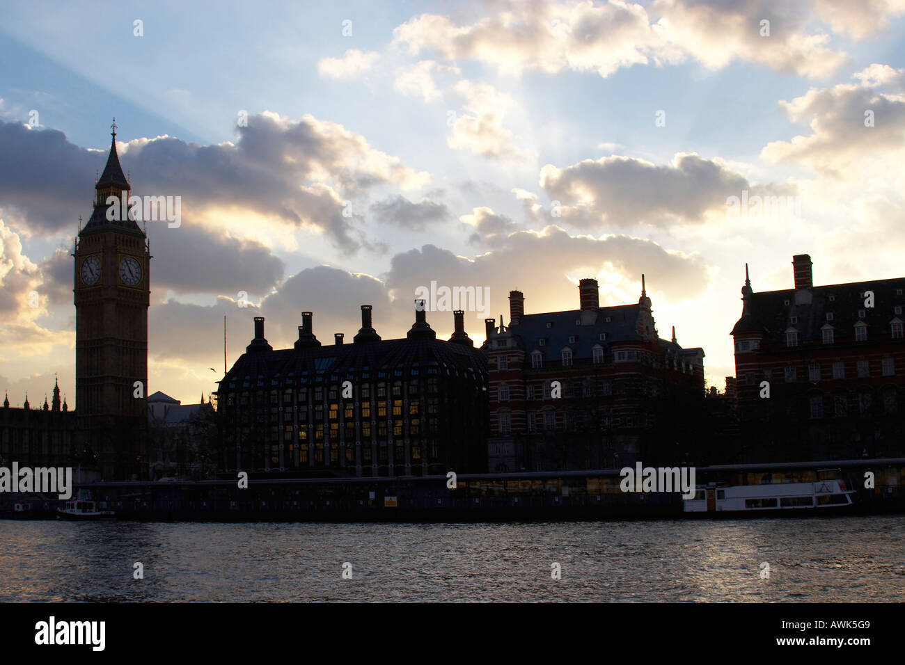 Big Ben and Portcullis House skyline in silhouette with sunrays of ...