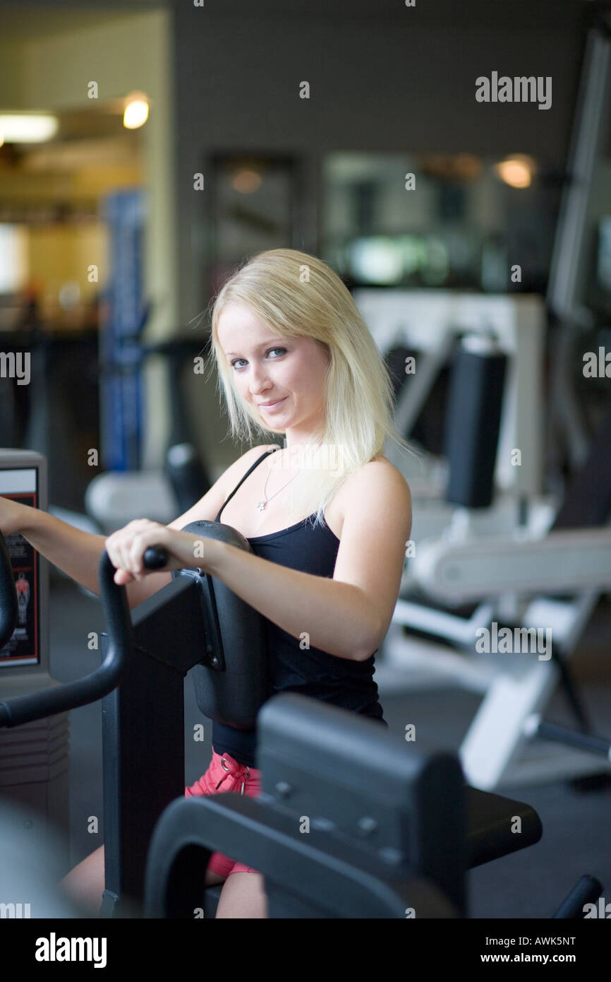 blonde woman trains her upper back Stock Photo - Alamy