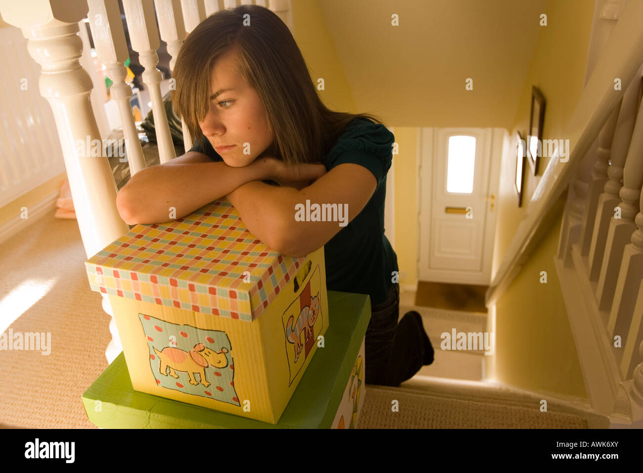 Girl carrying box stairs hi-res stock photography and images - Alamy