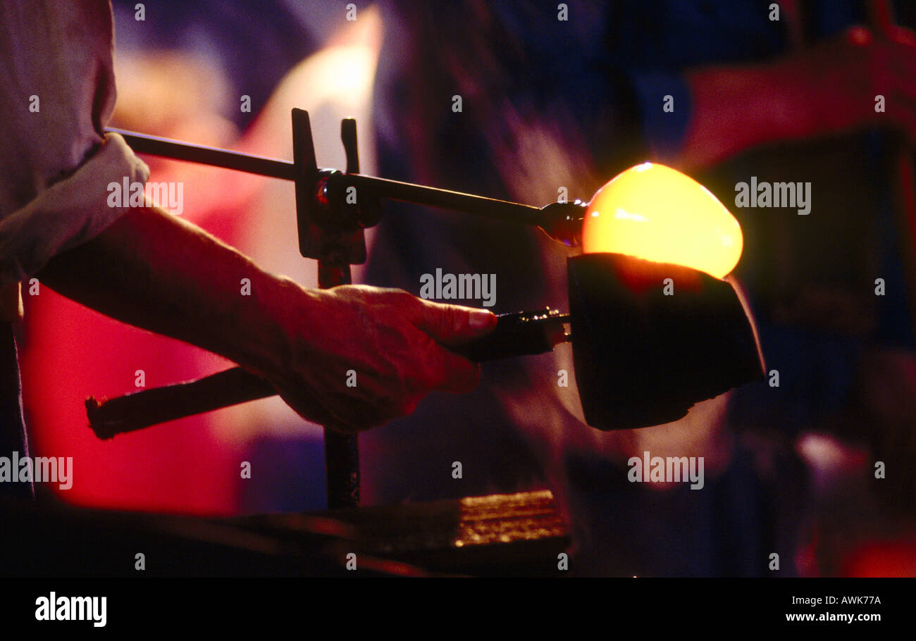 Mid section view of man blowing glass Stock Photo - Alamy