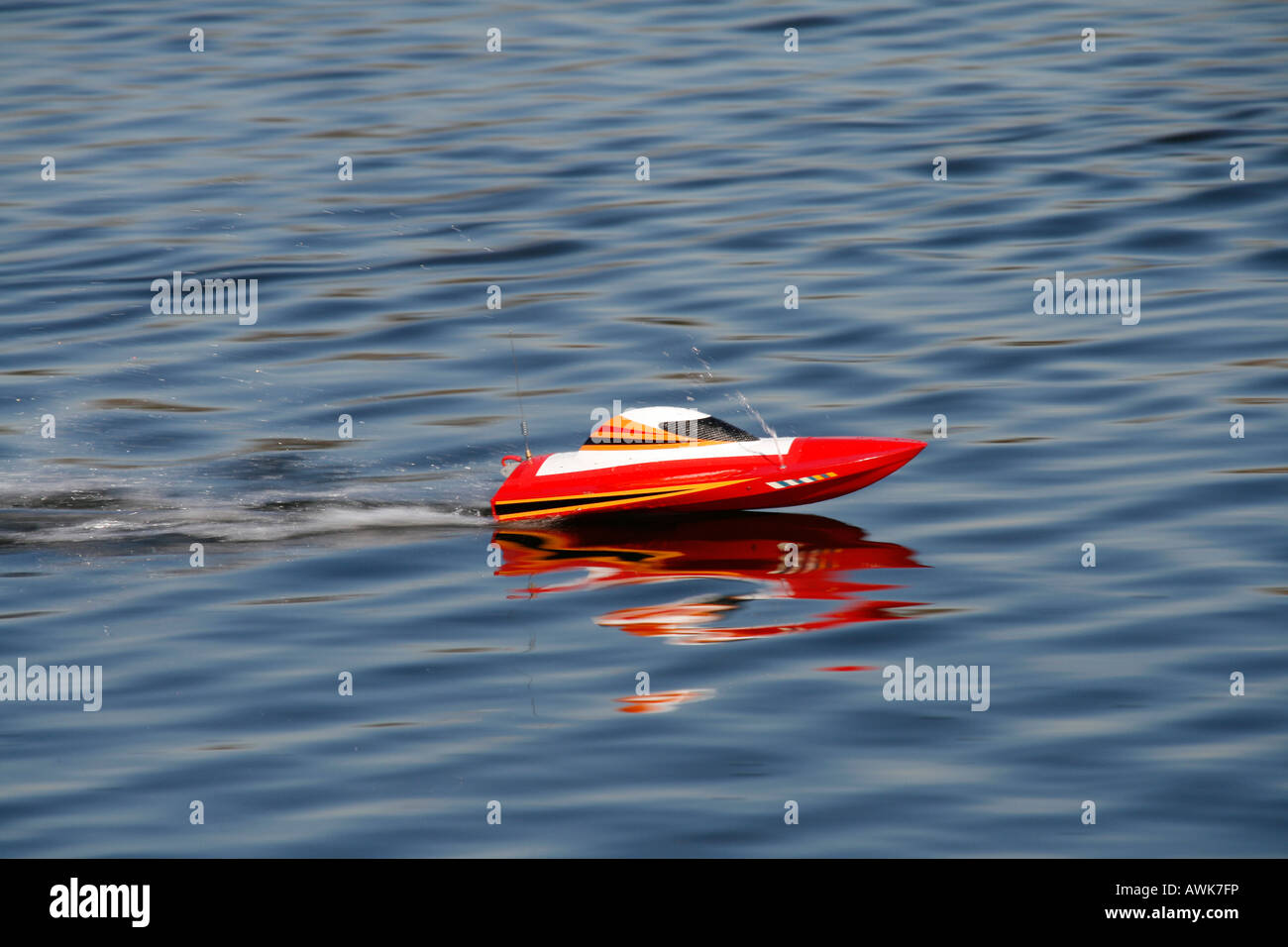 fast toy speed boat on lake Stock Photo - Alamy