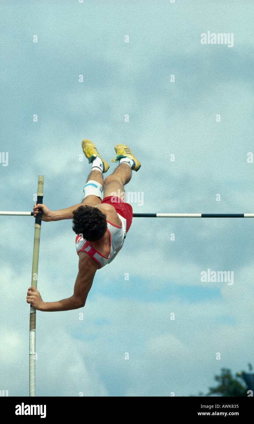 Man pole vaulting Stock Photo - Alamy