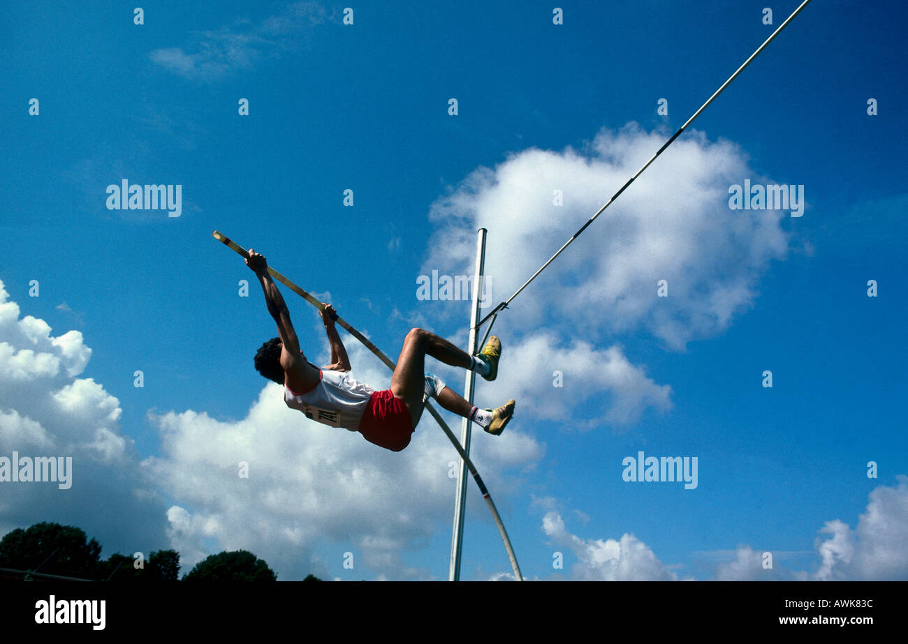 Side profile of man pole vaulting Stock Photo - Alamy
