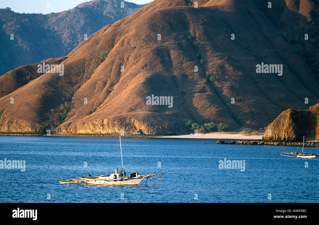 Fishing boat in sea at sunset, Komodo Island, Indonesia Stock Photo - Alamy