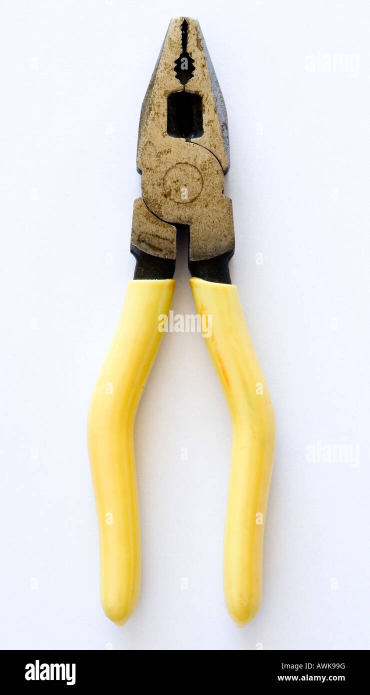 Close up view of a pair of pliers with yellow handles Stock Photo - Alamy