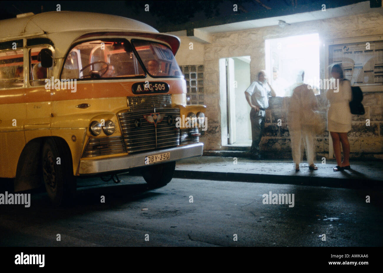 Passengers at bus stop, Valetta, Malta Stock Photo - Alamy
