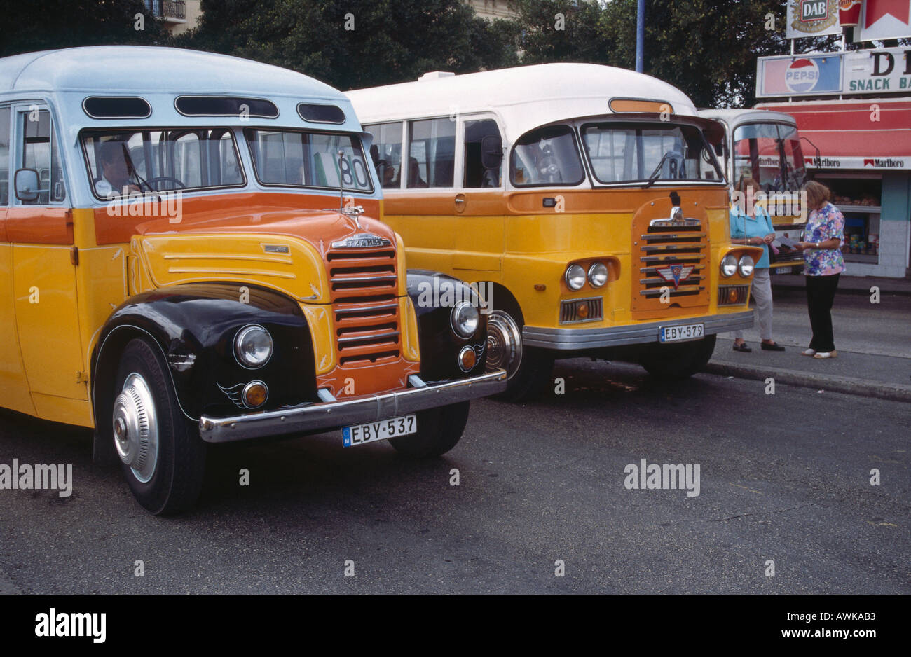 Passengers at bus stop, Valetta, Malta Stock Photo - Alamy