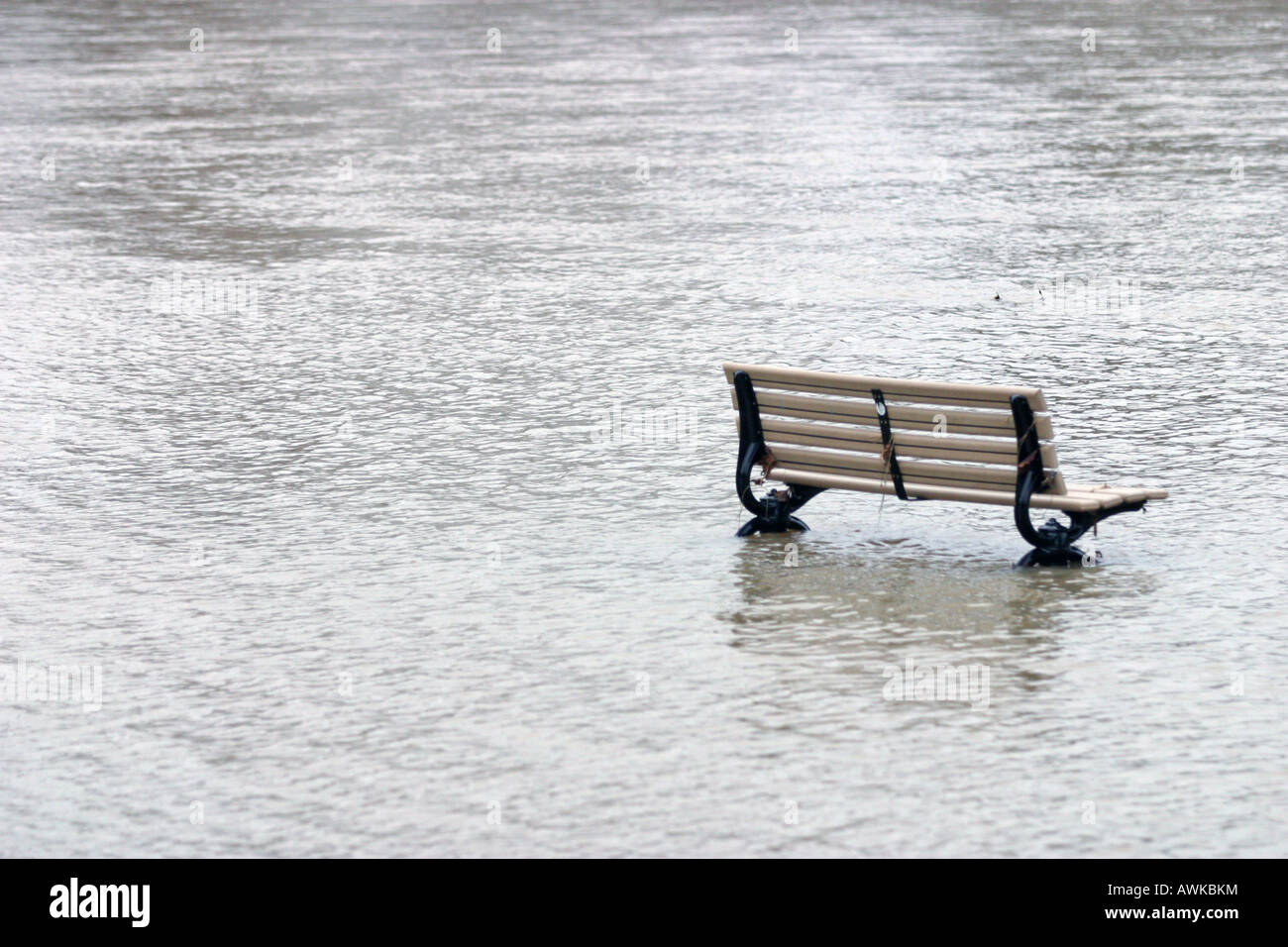Horizontal picture showing a flooded park bench during annual spring ...