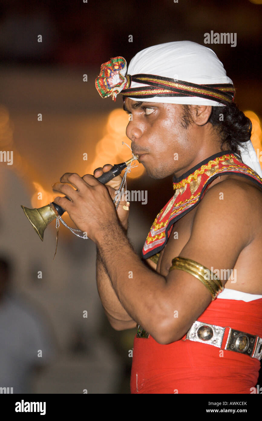 A man plays a traditional instrument in the Kandy perahera Stock Photo ...