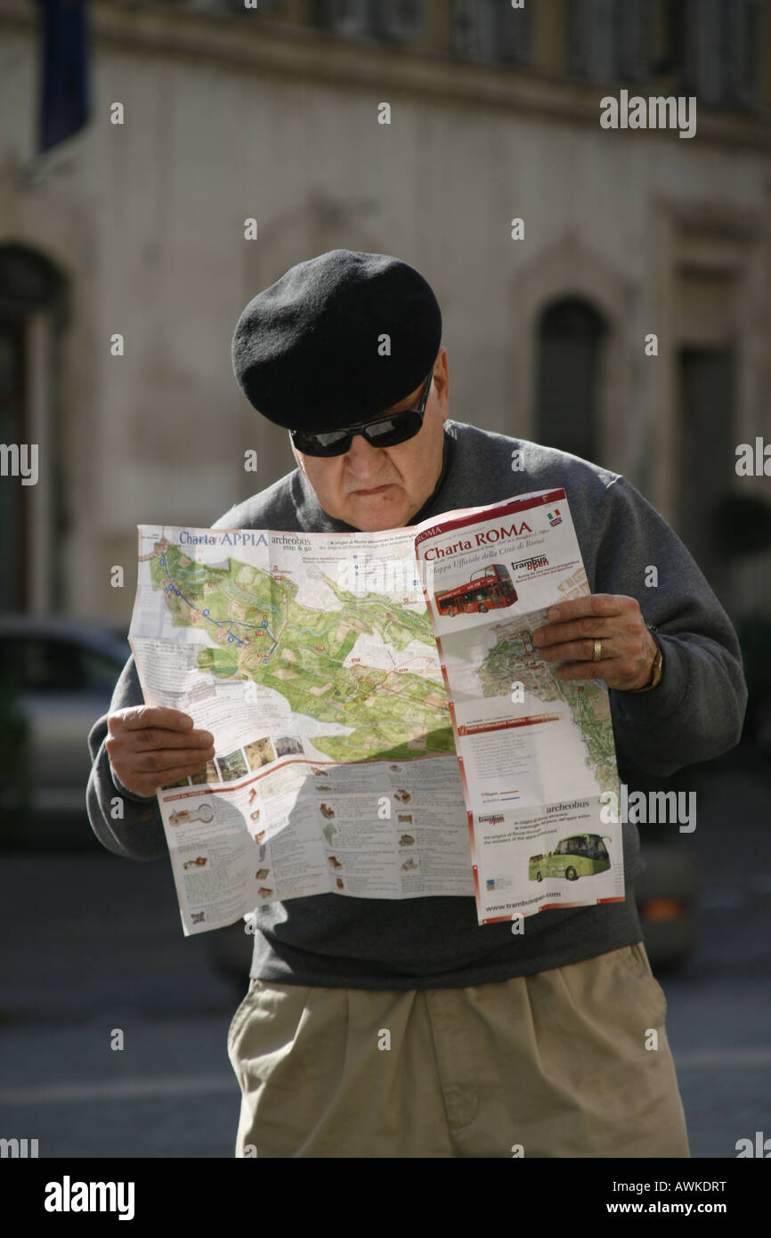 old man looking at map in rome Stock Photo - Alamy
