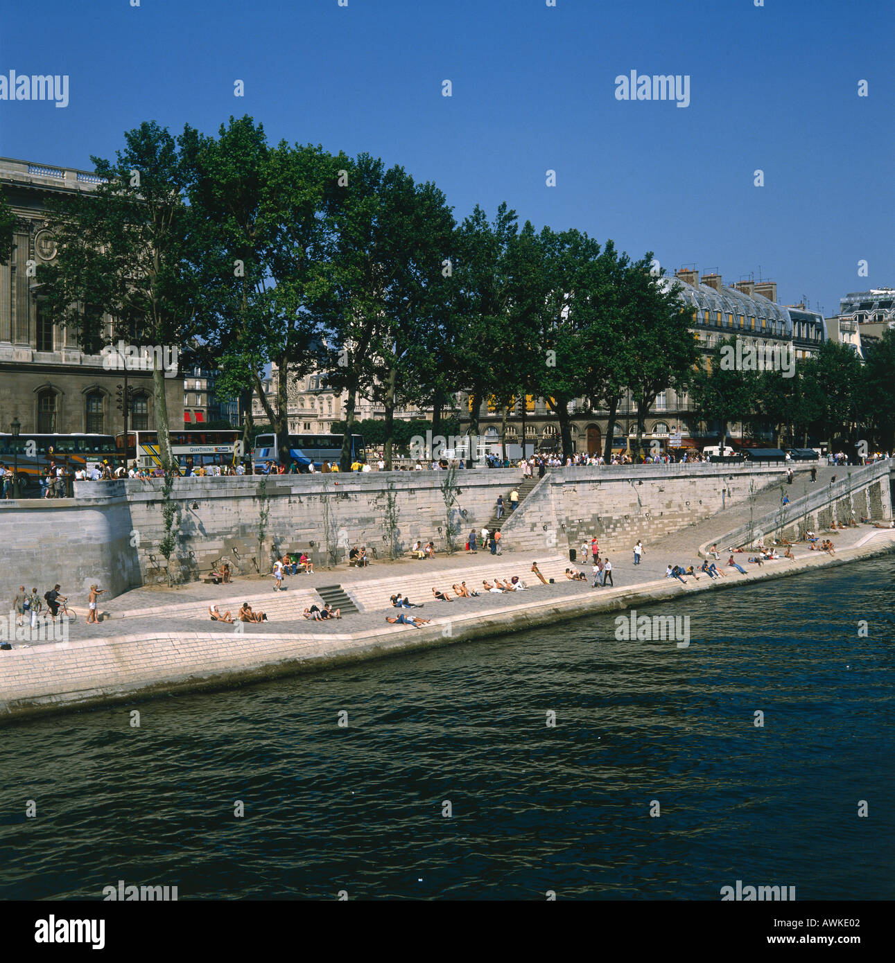 Tourists at riverside, Seine River, Quai du Louvre, Paris, Ile-De ...