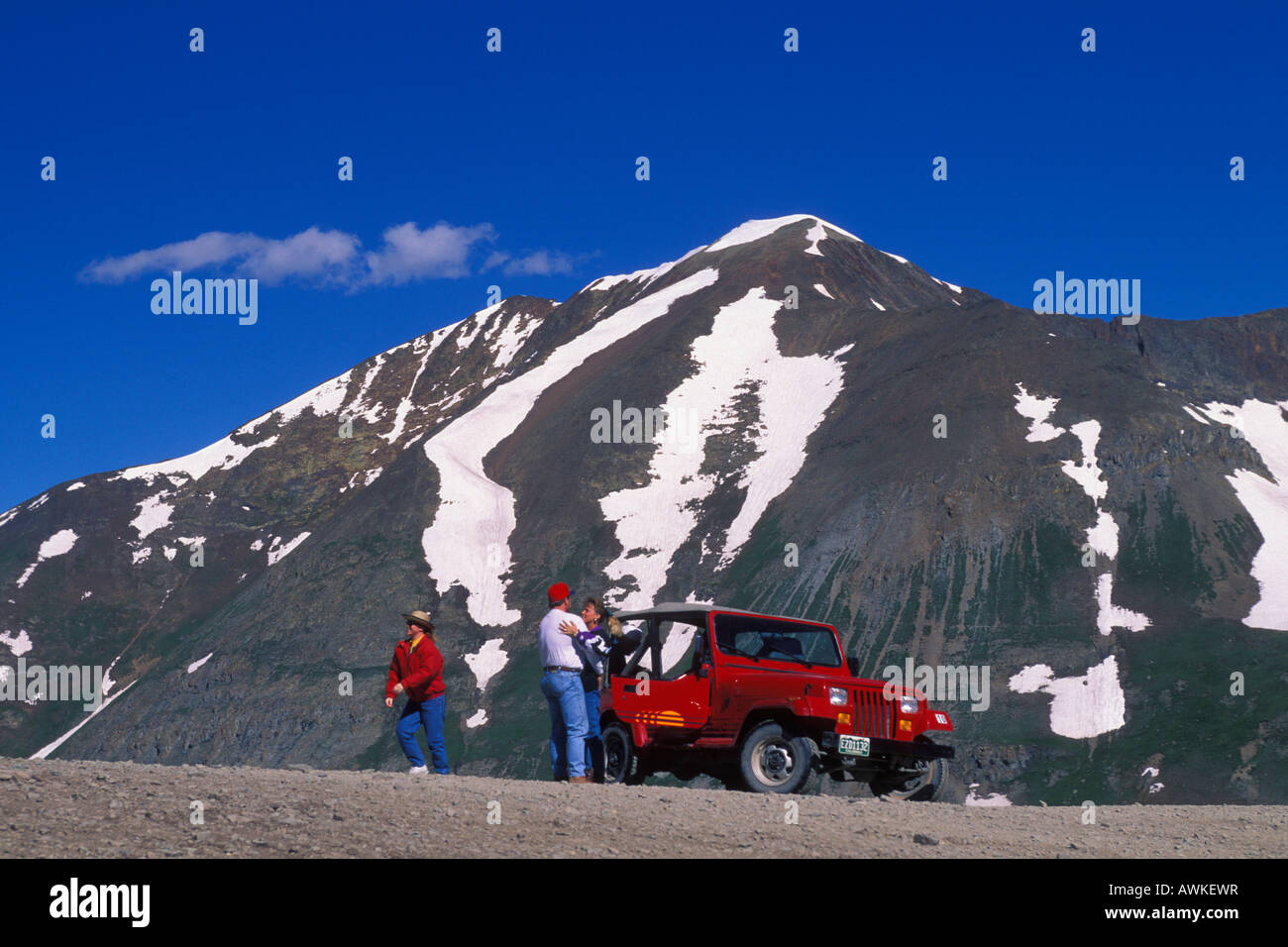 Visitors embrace atop Cinnamon Pass. Alpine Loop Scenic Byway, Colorado ...