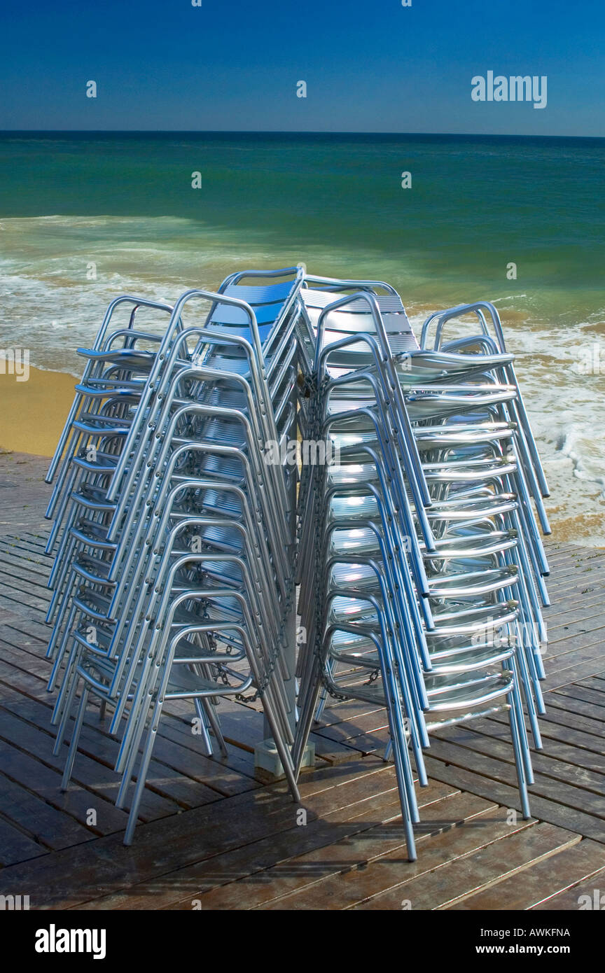 CHAIRS PILED. PILES OF CHAIR IN BEACH TERRACE Stock Photo - Alamy