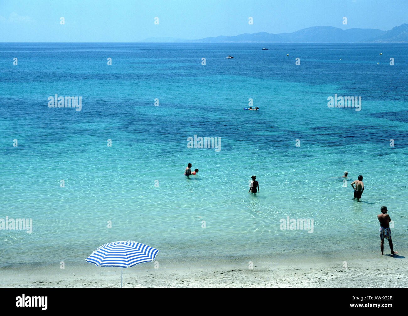 France, Corsica, people wading at beach Stock Photo - Alamy