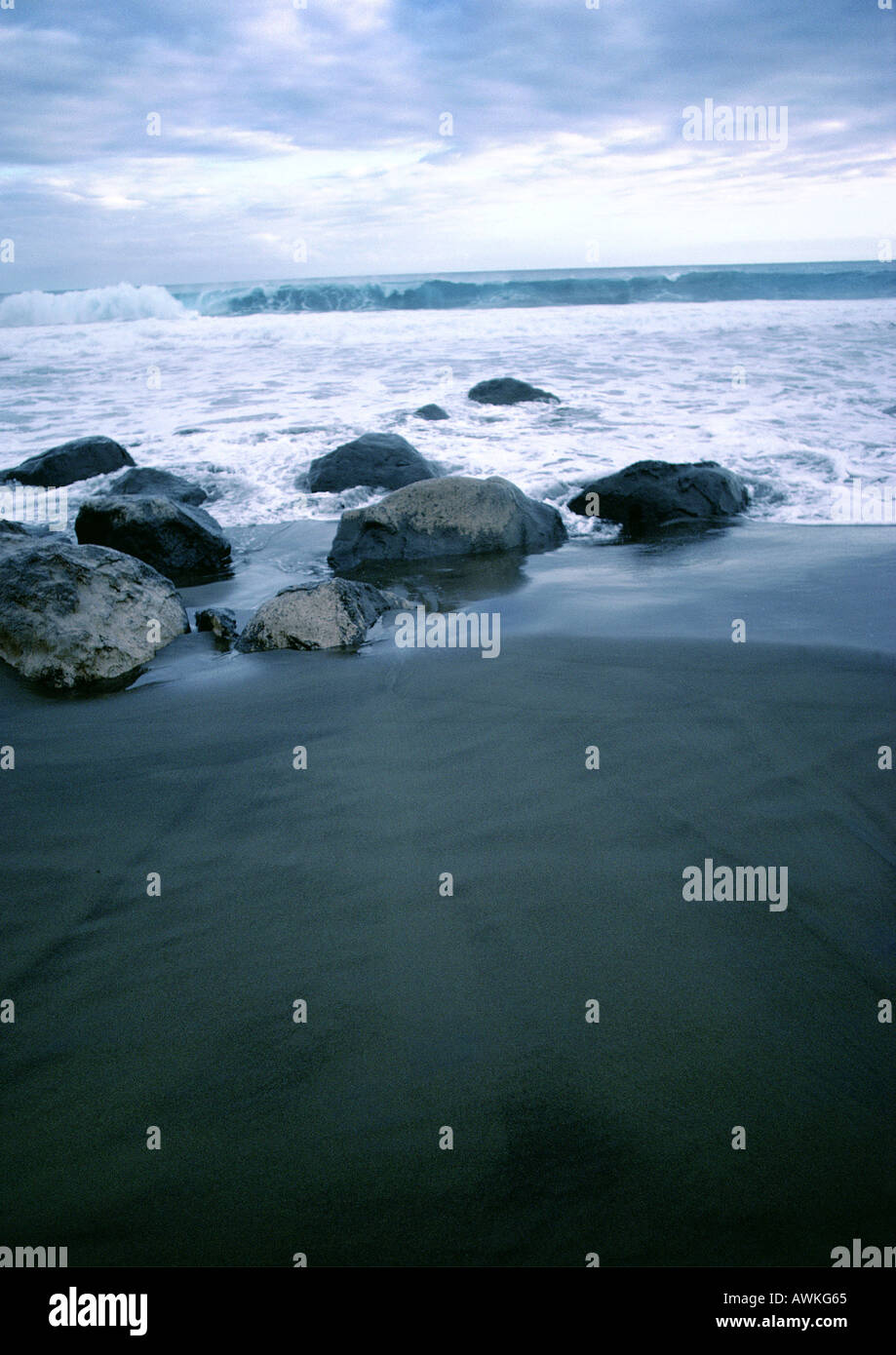 Rocks on beach Stock Photo - Alamy