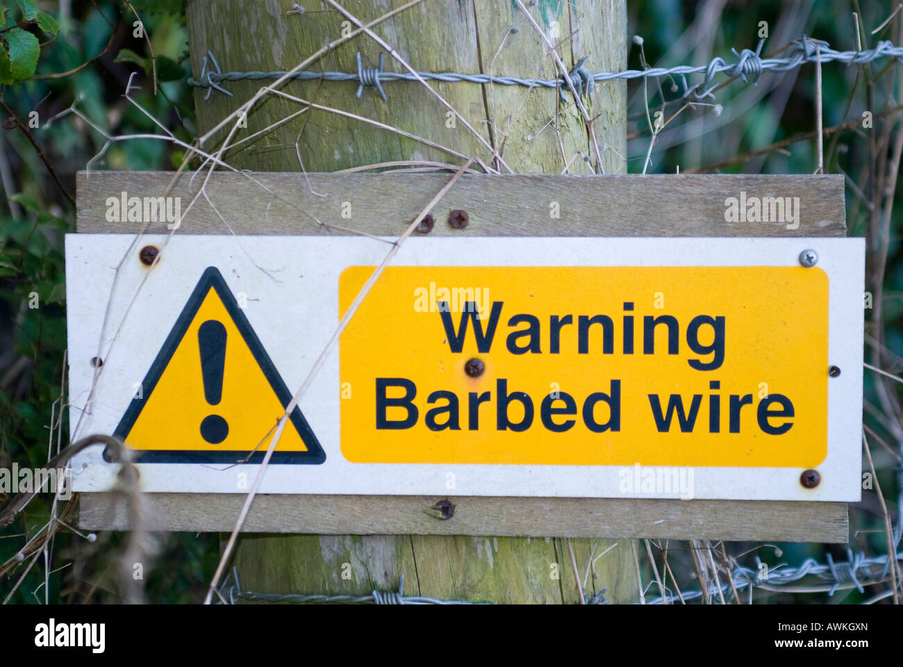 Barbed Wire Warning Sign Stock Photo - Alamy