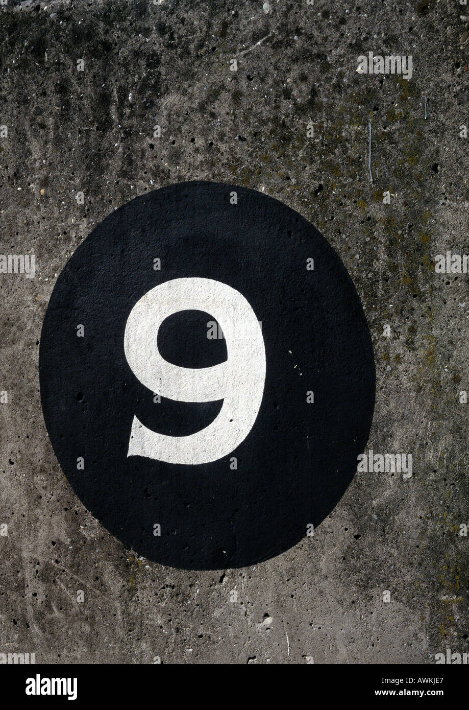 9 text painted on black circle on rough surface Stock Photo - Alamy