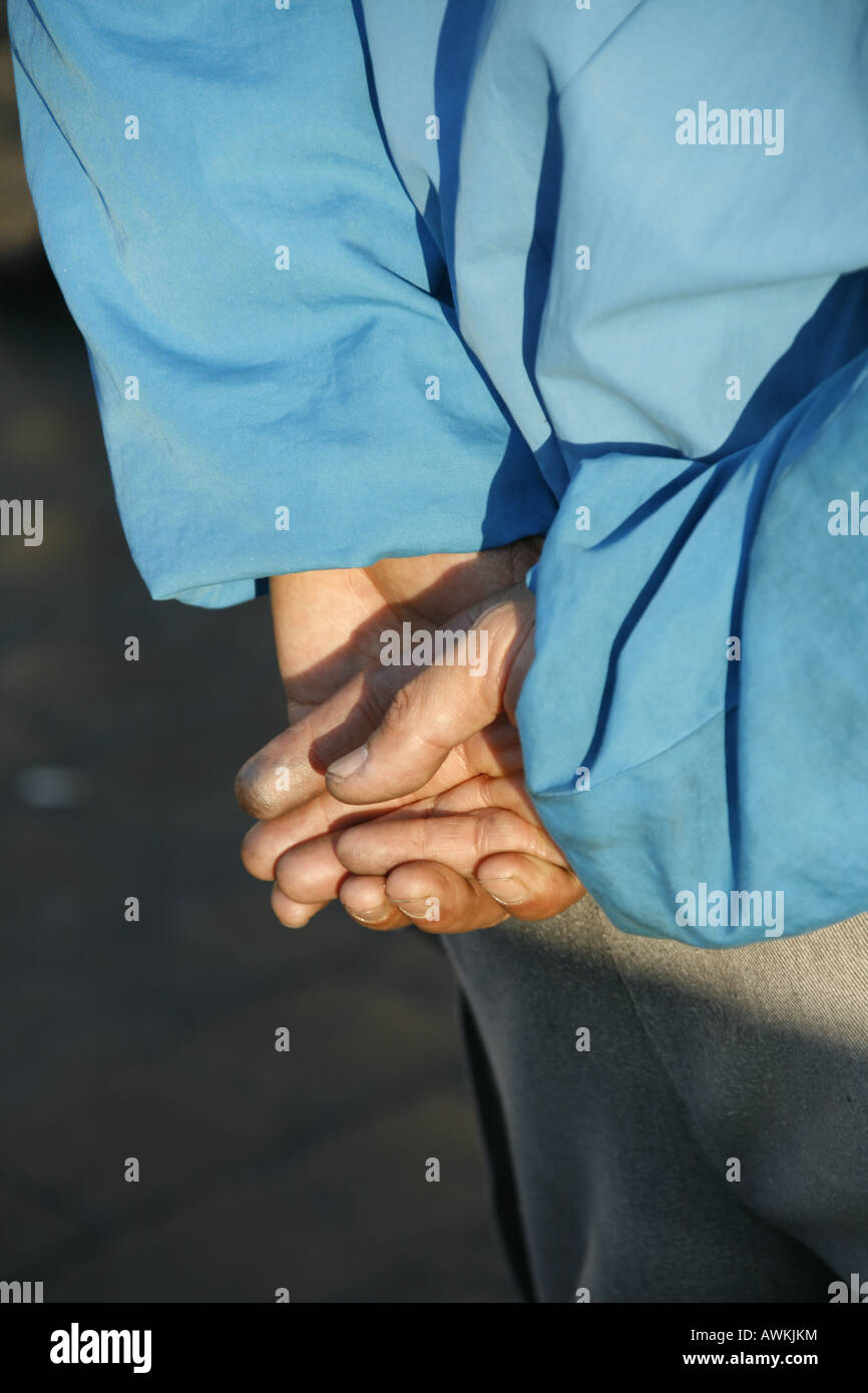man with hands behind back Stock Photo - Alamy